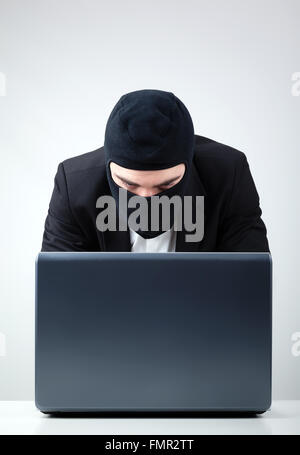 portrait of hacker with mask and binary code background Stock Photo - Alamy