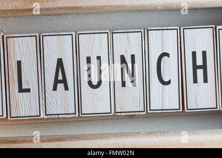 launch word written on wood block. launch text on table, concept Stock ...