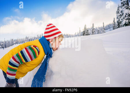 Boy eating snow Stock Photo - Alamy
