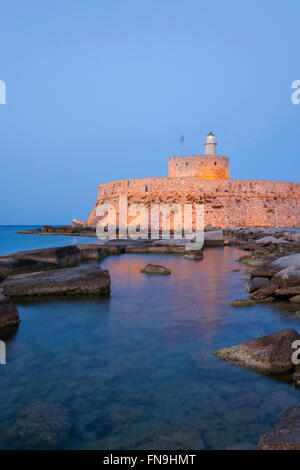 Agios Nikolaos Fortress with Lighthouse, Mandraki Harbour, Rhodes Town, Rhodes, Greece Stock ...