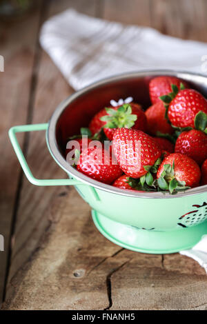 Fresh tasty strawberries in a colander isolated on white Stock Photo ...