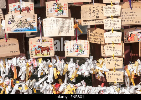 O-mikuji, prayer papers, and Japanese prayer plaques (boards), Ema ...
