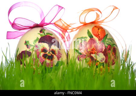 Handmade decoupage Easter egg on a handmade paper decorated with a ...