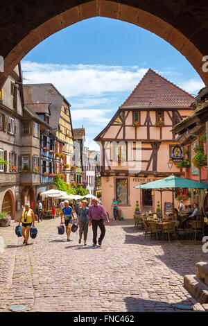 medieval tower (dolder) and half-timbered houses in riquewihr in alsace ...