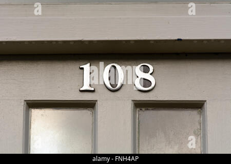 House Number 108 sign on wall Stock Photo - Alamy