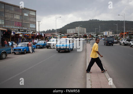 Addis Ababa Ethiopia taxis cars and huts by the roadside Stock Photo ...