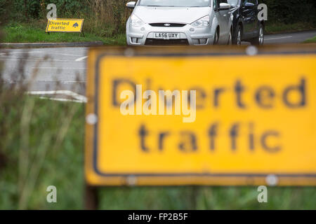 Diverted traffic sign. Road sign showing a diversion all the way around ...