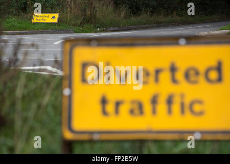 Diverted traffic sign. Road sign showing a diversion all the way around ...