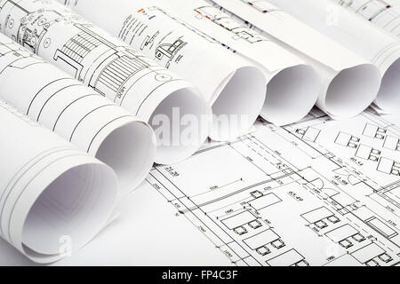 Blueprints and rolls of blueprints, side view. Building concept Stock ...