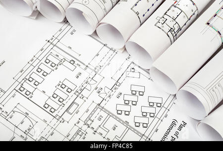 Blueprints and rolls of blueprints, side view. Building concept Stock ...