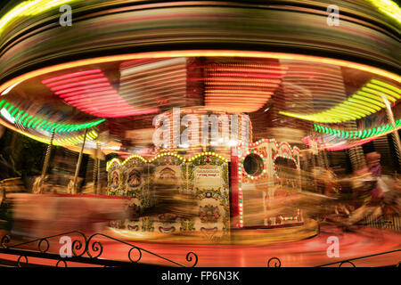 Carousel Merry go round blurr Stock Photo - Alamy