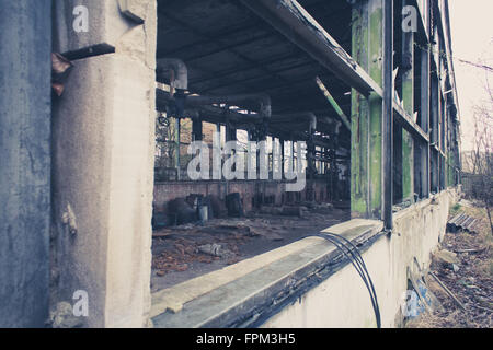 Messy abandoned factory room Stock Photo - Alamy