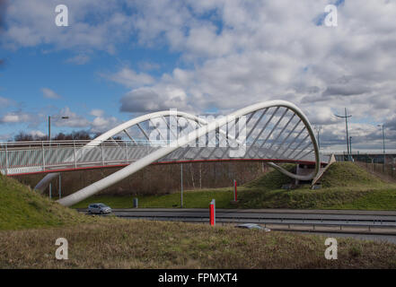 The Saints bridge in St Helens Merseyside, floodlit in colours in the ...