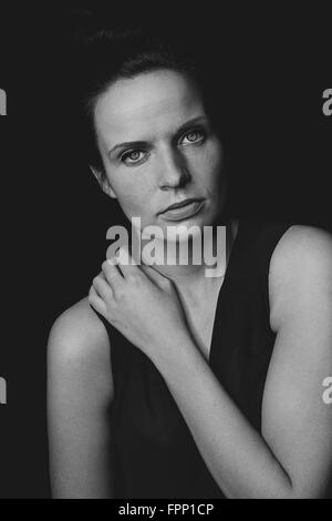 Woman looking questioningly Stock Photo - Alamy