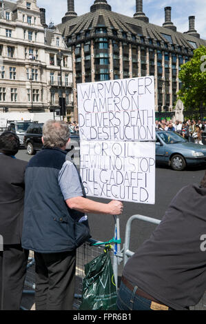 Activist holding a sign in Parliament Square in support of the Defend ...
