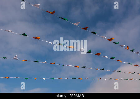 Irish Tricolour bunting flies overhead on Belfast's Falls Road Stock ...