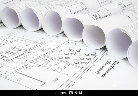Blueprints and rolls of blueprints, side view. Building concept Stock ...