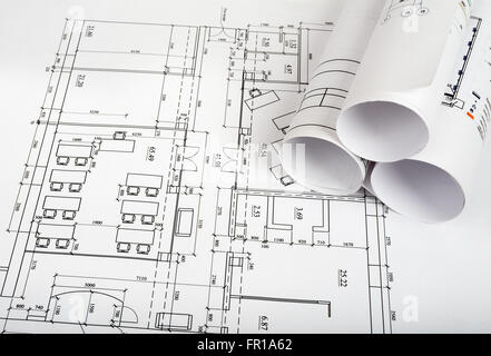 Blueprints and rolls of blueprints, side view. Building concept Stock ...