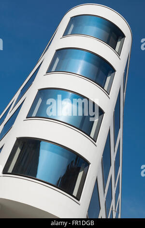 Modern architecture and facade with bended pane windows in a building's ...