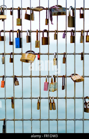 Padlocks chain fastened to the bridge Stock Photo - Alamy