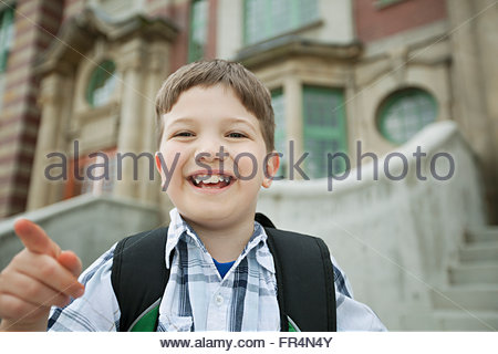 student boy outside at school standing Stock Photo - Alamy