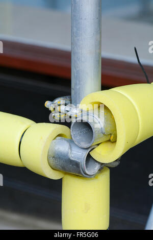 Scaffolding poles with safety foam with mid-rail rigid brace on ...