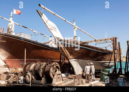 Traditional dhow in the dockyard of Manama, Kingdom of Bahrain Stock ...