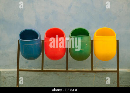 Four bins for separate waste collection Stock Photo - Alamy