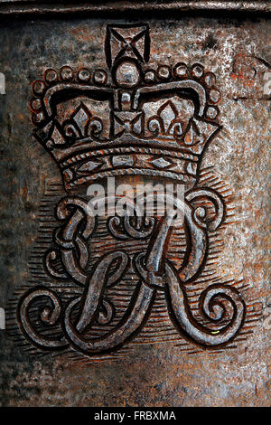 Detail of the coat of arms of the Portuguese Crown in the old cannon ...
