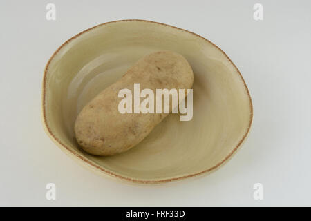 Raw potato, potato in bowl, raw potato for baking Stock Photo - Alamy