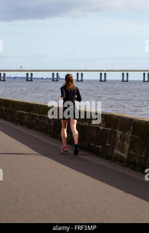Jogging along riverside Stock Photo - Alamy