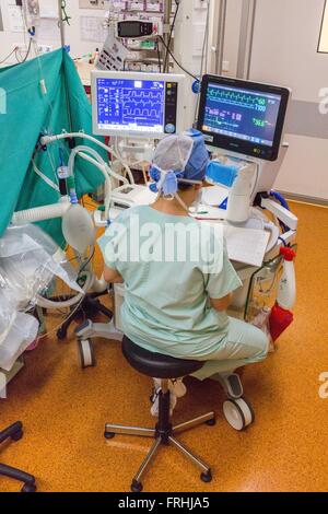 In the Hospital Operating Room Anesthesiologist Applies Anesthesia Mask ...
