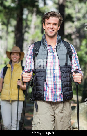 Portrait of handsome young man hiking in nature. Caucasian man walking ...