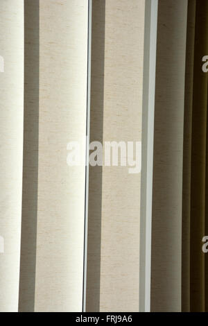 Sun shining through window blinds in room Stock Photo - Alamy