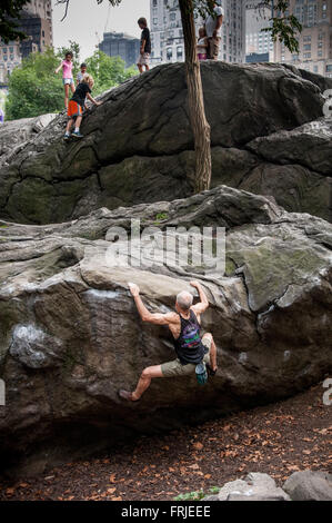 New York City, children climb on the "Alice in Wonderland" Statue in ...