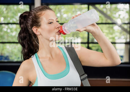 woman drinking water after workout Stock Photo - Alamy