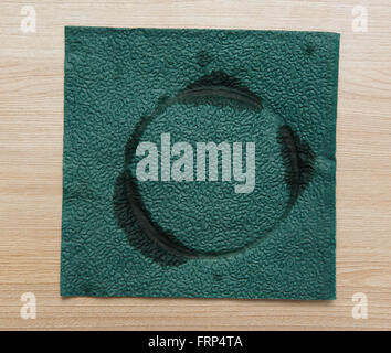 Single used paper green napkin in closeup Stock Photo - Alamy