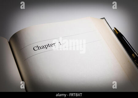 chapter one, in an open book with a pen Stock Photo - Alamy