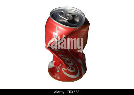 An Empty Dented and Crushed Can of Coca-Cola on a white background ...