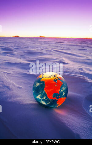 Conceptual image of the earth laying in the tall green grass. Shallow ...