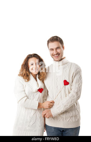 Happy young couple with red hearts on pink background Stock Photo - Alamy