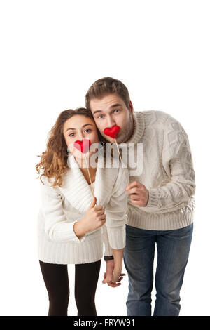 Happy young couple with red hearts on pink background Stock Photo - Alamy
