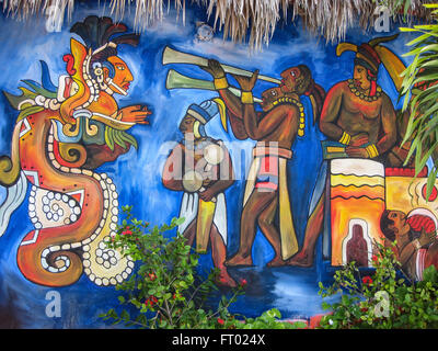 Colorful murals depicting Mayan culture on walls near Chichen Itza ...