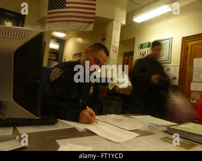 NYPD Officer filing report Stock Photo - Alamy
