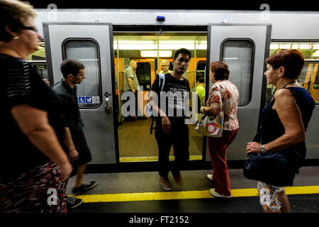 People getting off a subway train in Tokyo, Japan. Abstract out-of ...