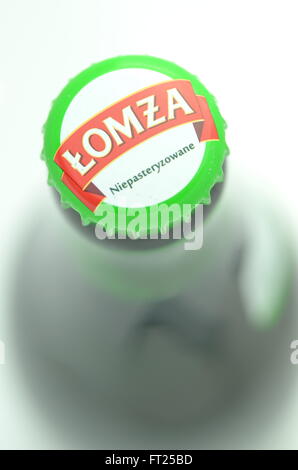 Lomza unpasteurized lager beer isolated on white background. Lomza ...