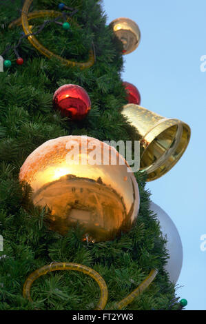 Christmas decoration on fur-tree in blue lights Stock Photo - Alamy