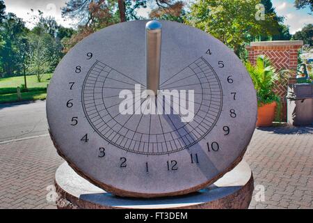 An old sundial made of a large stone with a metal rod, the clock will ...