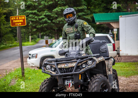 U.S. Border Patrol Agent Matt Solosbal snugs the straps to his full ...