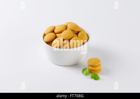 bowl of round sponge biscuits Stock Photo - Alamy